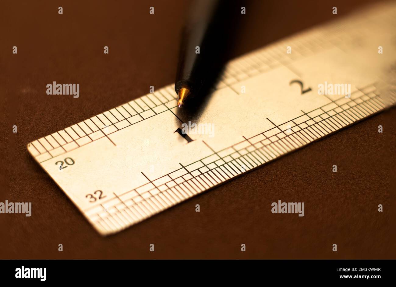 Close up of a stainless steel scale r ruler showing a one inch point ...