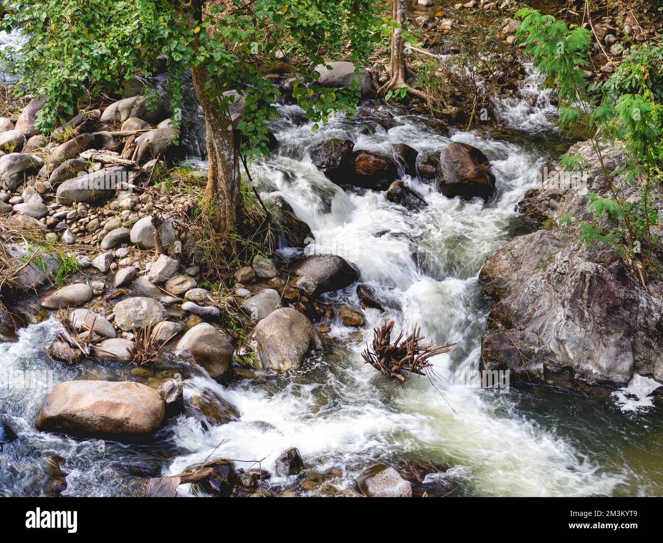 The water is flowing through the rocks Stock Photo - Alamy
