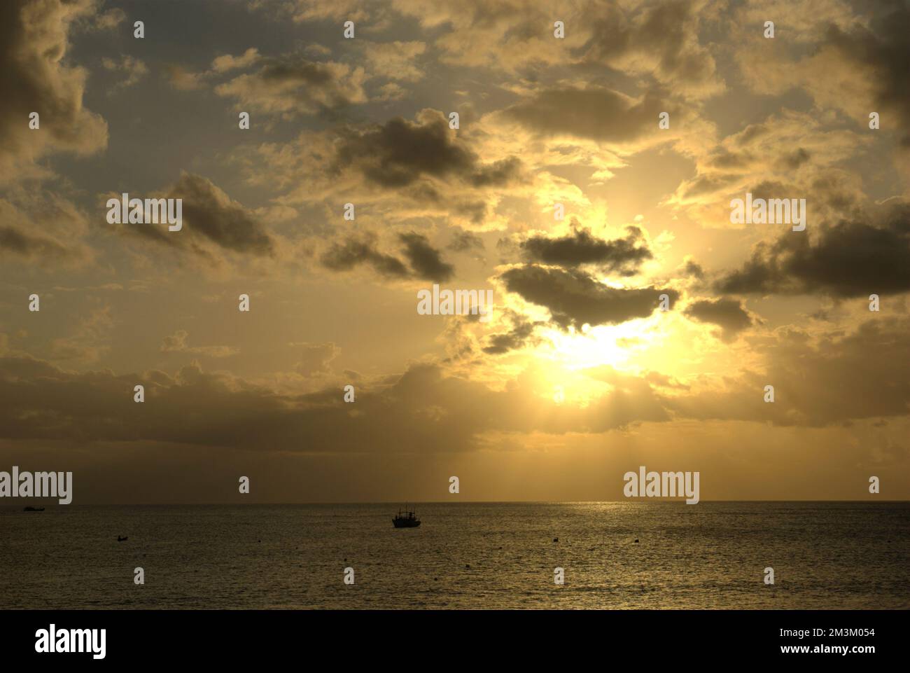 Fishing boat drifting on Savu Sea around sunset time off the coast of ...