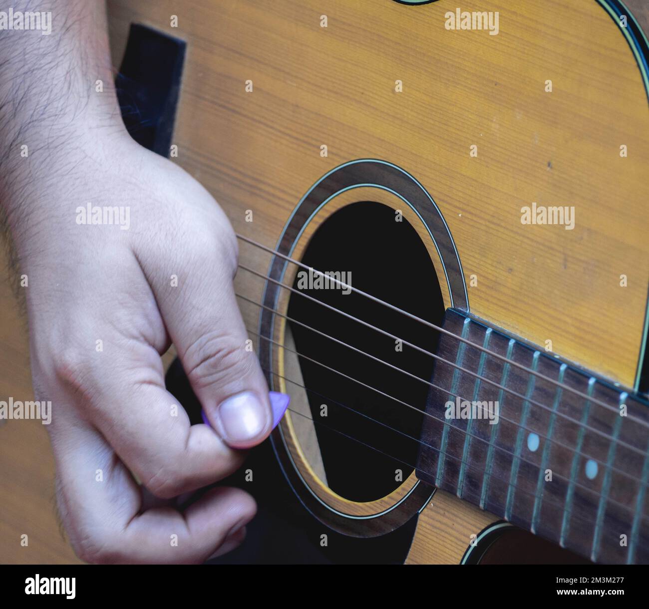 Looking at the fretboard of the guitar hi-res stock photography and ...