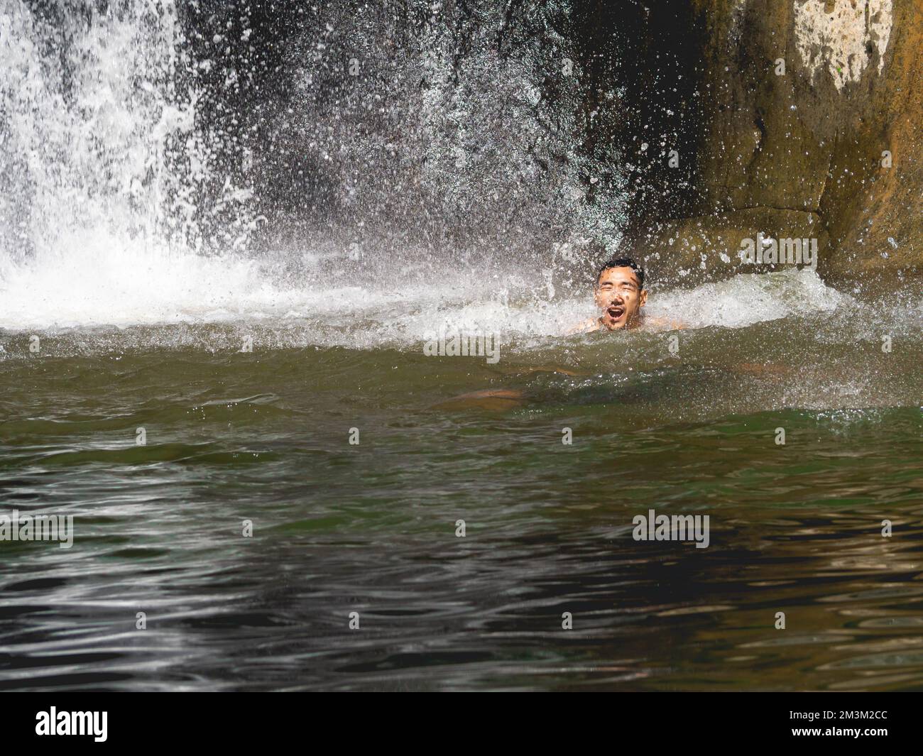 Man swimming in waterfall hi-res stock photography and images - Alamy