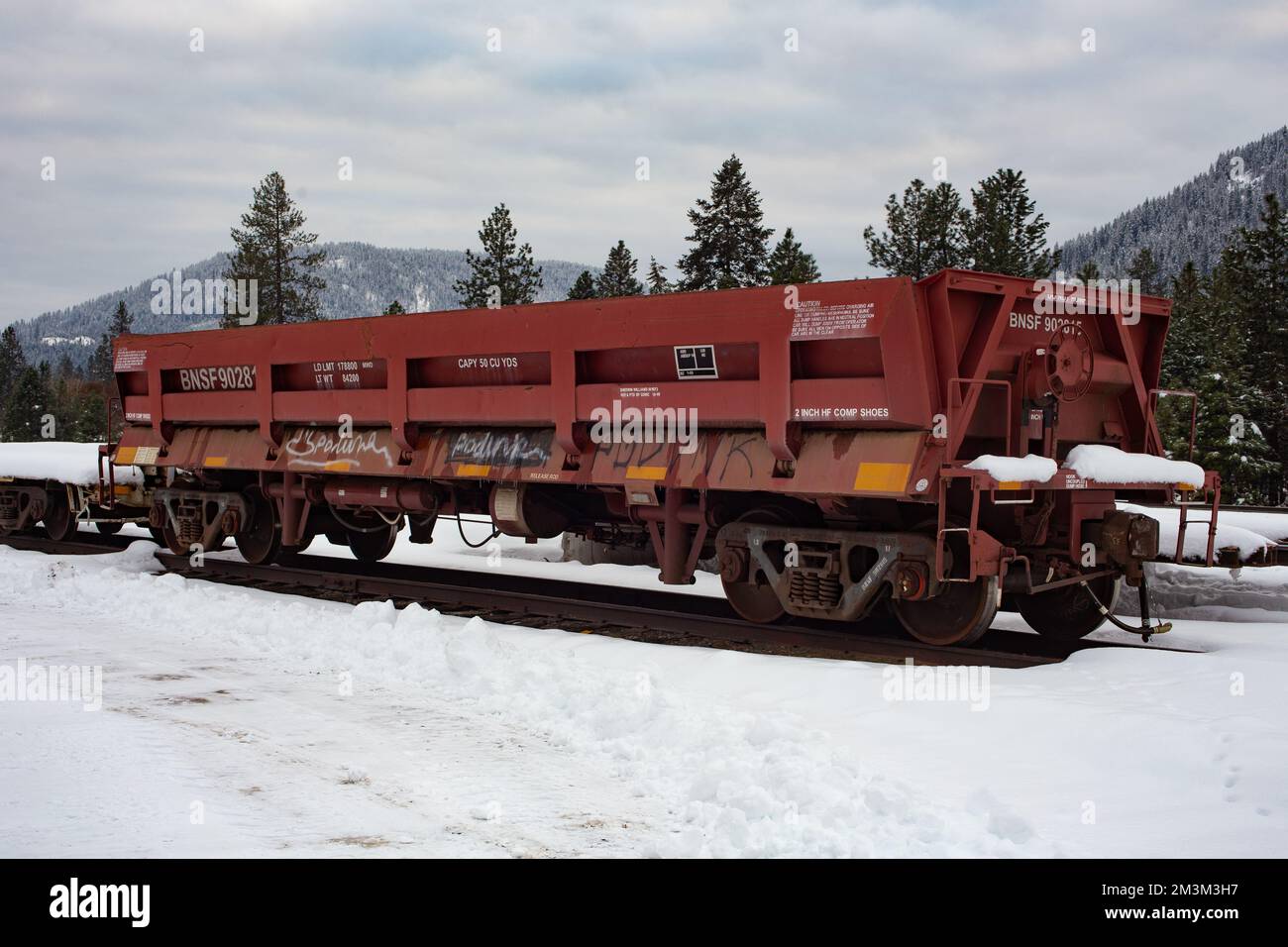 A railroad dump car on the tracks at the BNSF train yard, in the town ...