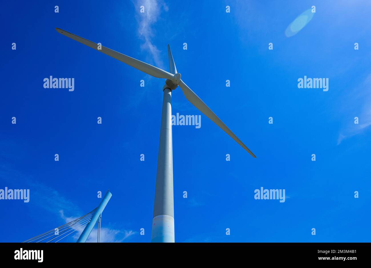 A wind power landscape under blue sky and white clouds. The windmills ...