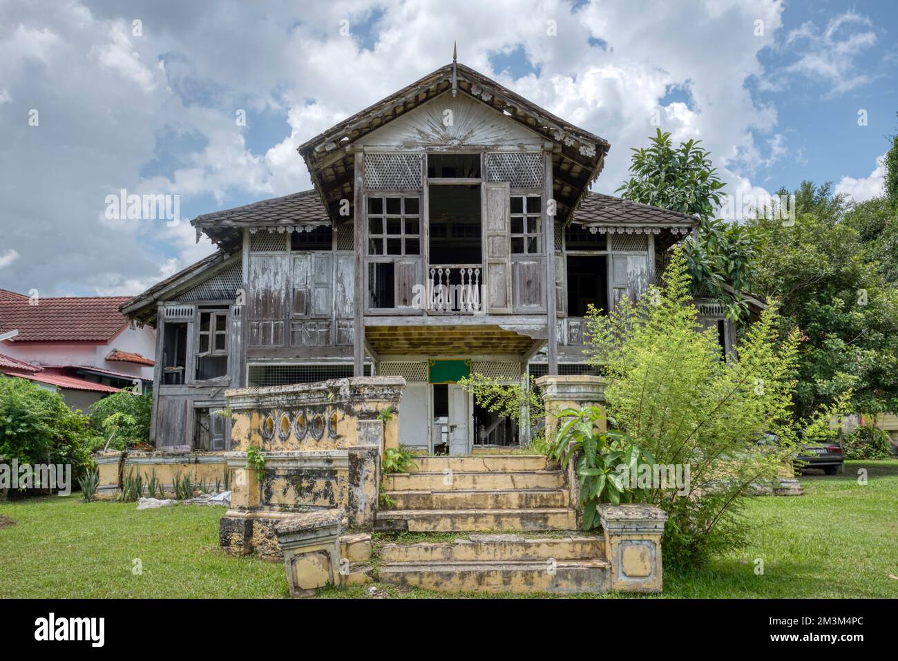 two-storey deserted malay structure cottage home Stock Photo - Alamy