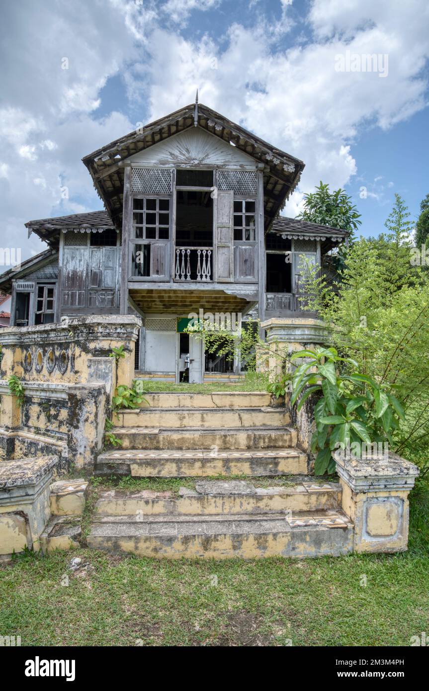 two-storey deserted malay structure cottage home Stock Photo - Alamy
