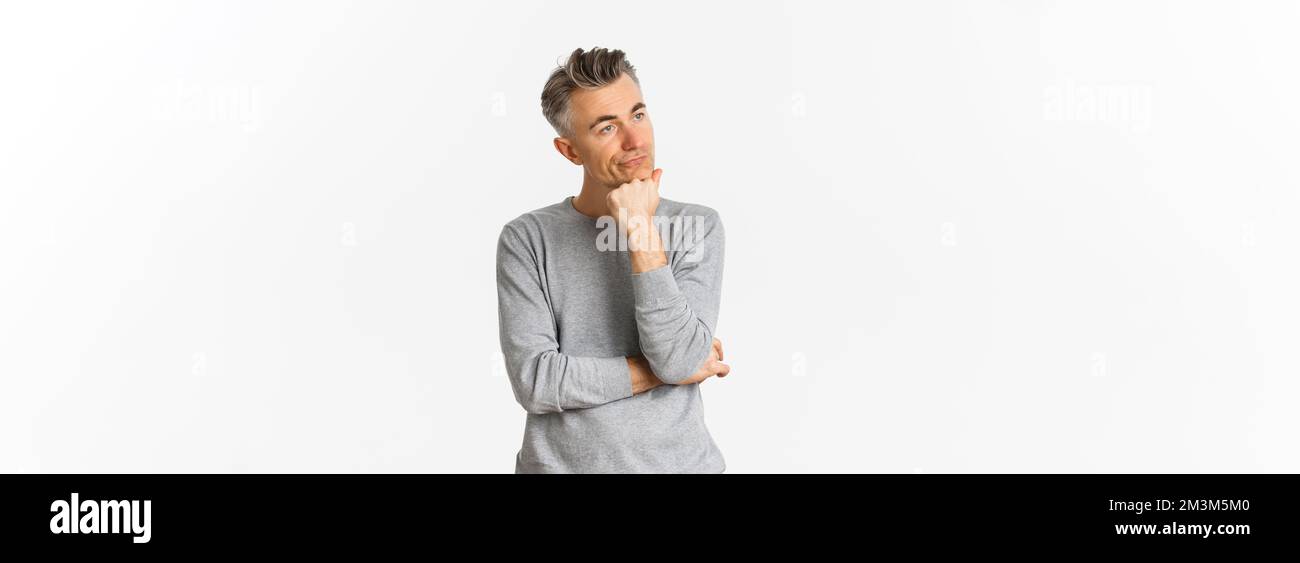 Portrait of bored and gloomy middle-aged man, leaning on hand and ...