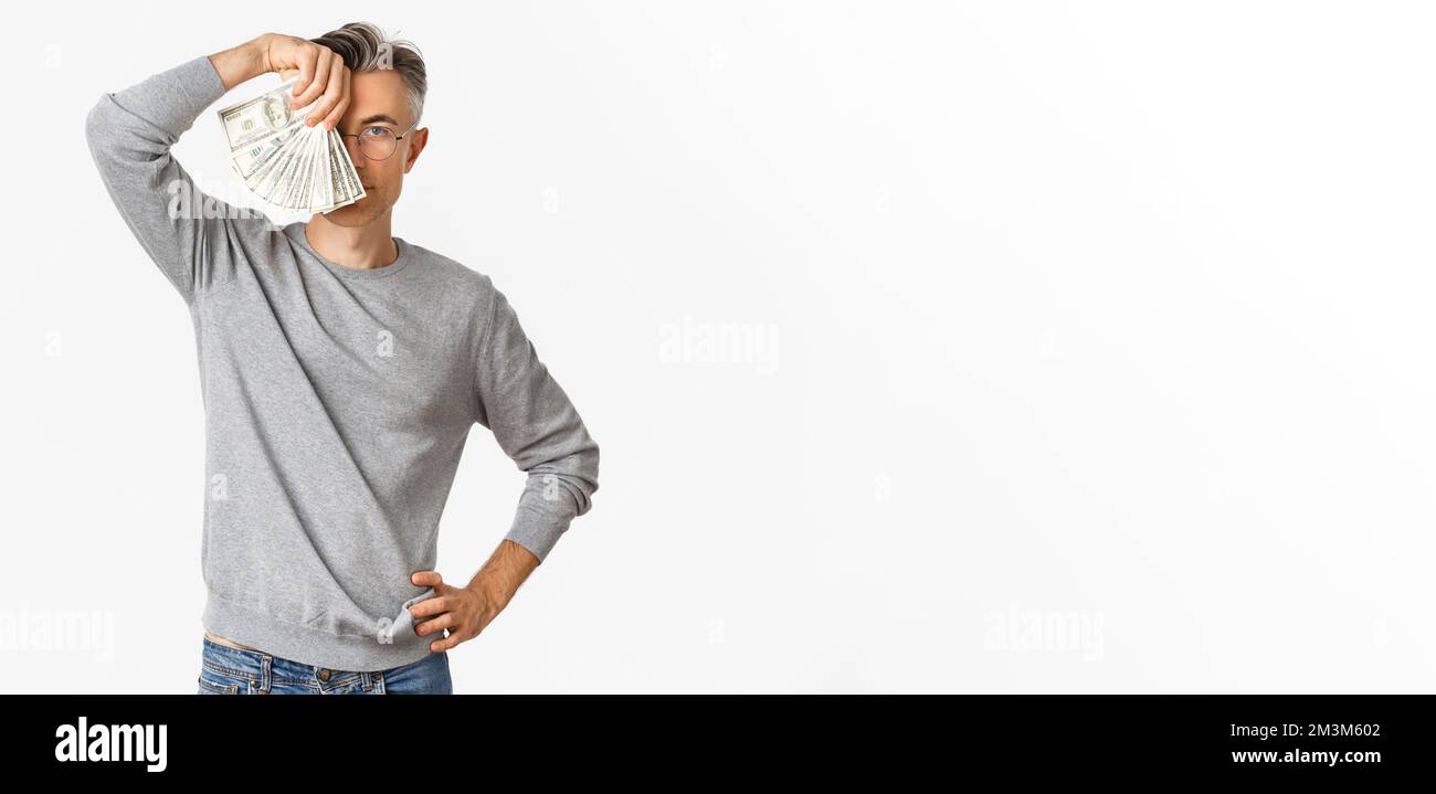 Portrait of successful and rich middle-aged man in gray sweater ...