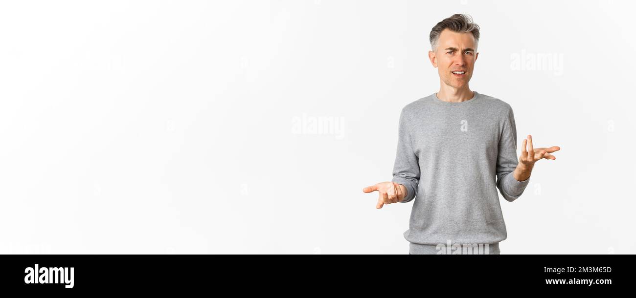 Portrait of confused and disappointed middle-aged man arguing, cant ...