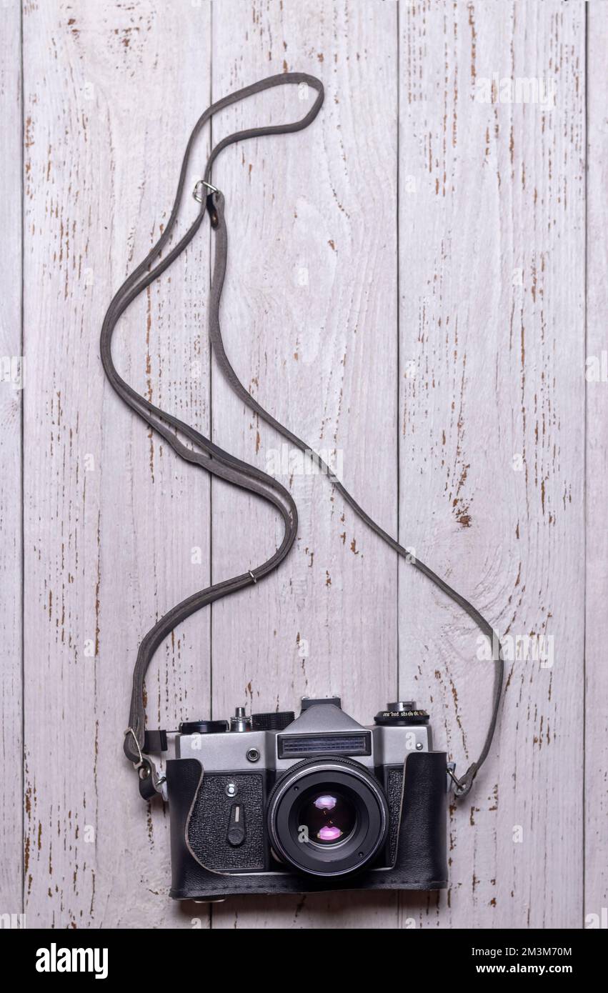 Old retro camera in a casing and a neck strap. View from above Stock ...