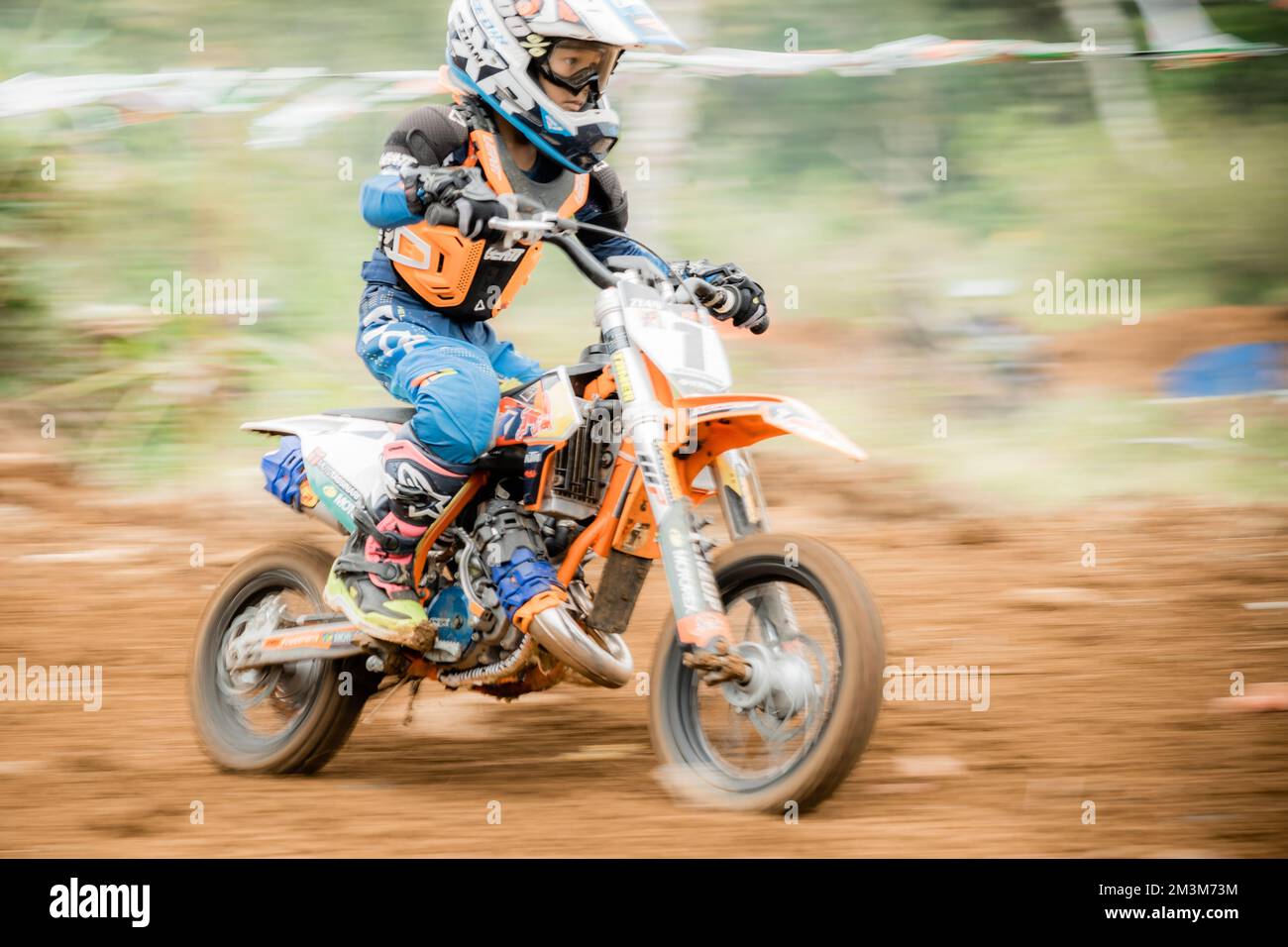 A kid riding a motorcycle on motocross exhibition play Stock Photo - Alamy