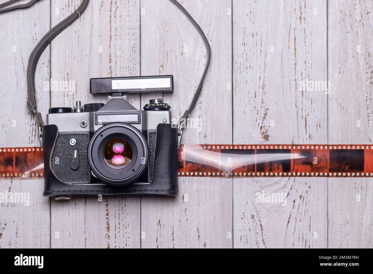Old retro camera in a case and lens flare. View from above Stock Photo ...