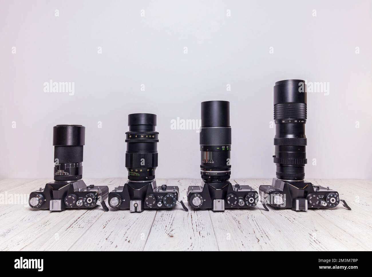 Old retro cameras with different focal lengths of the lens Stock Photo ...