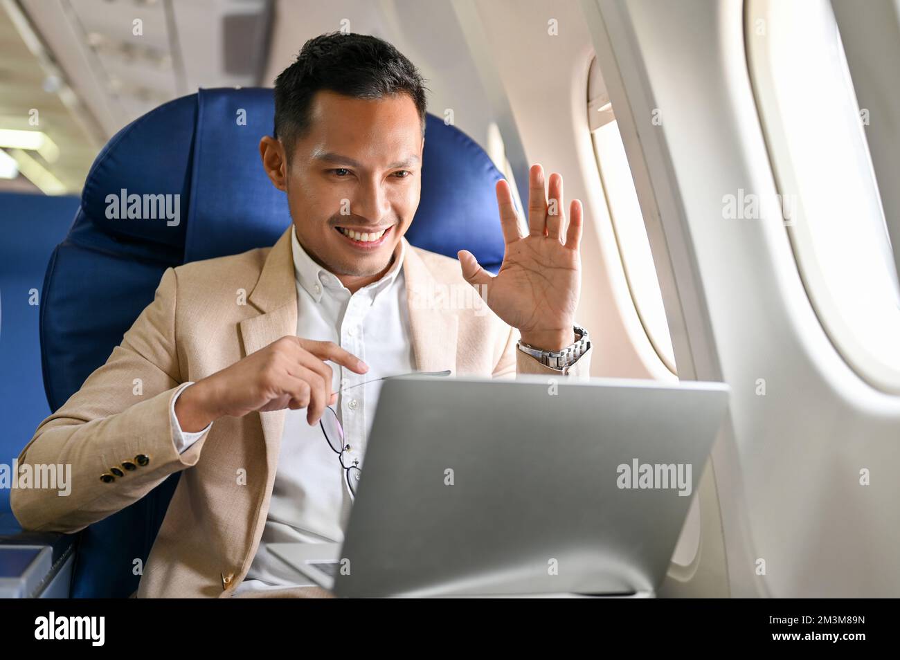 Professional and successful Asian businessman or male CEO waving his ...