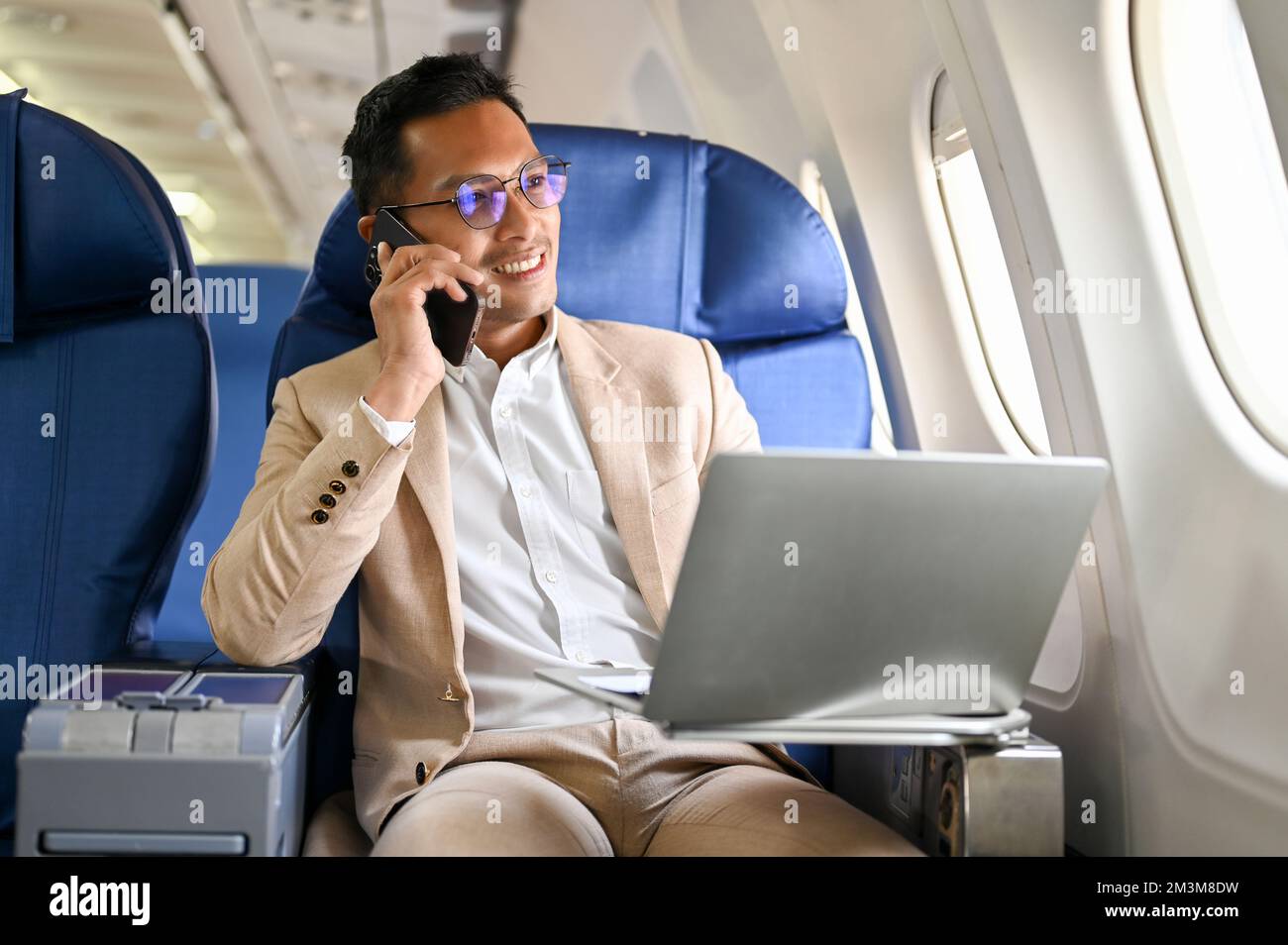 Successful and smart Asian businessman on the phone with his business ...