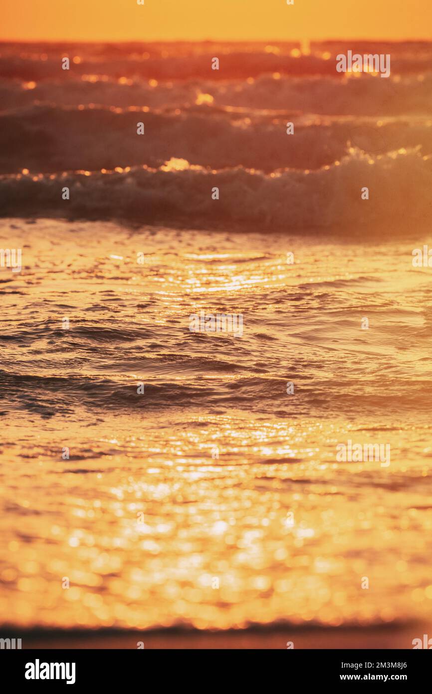 Sunset above sea. Natural sunrise sky warm colors over ripple sea with ...