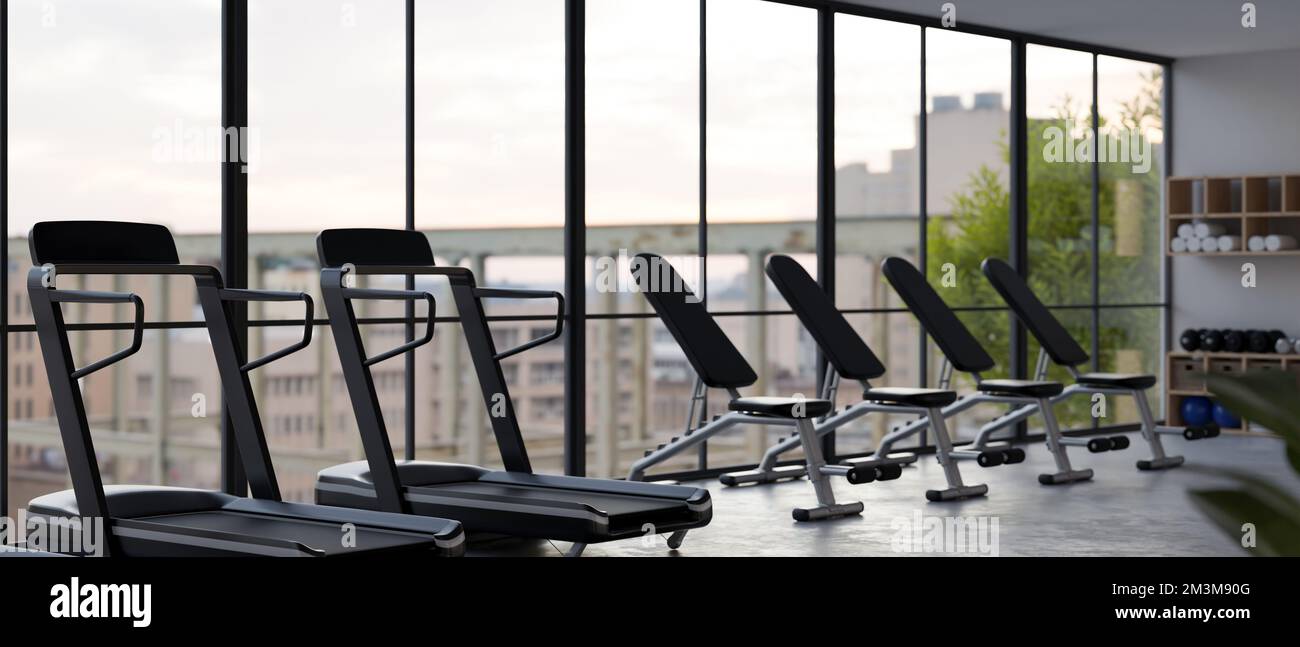 Modern fitness on the building interior design with a row of treadmill ...