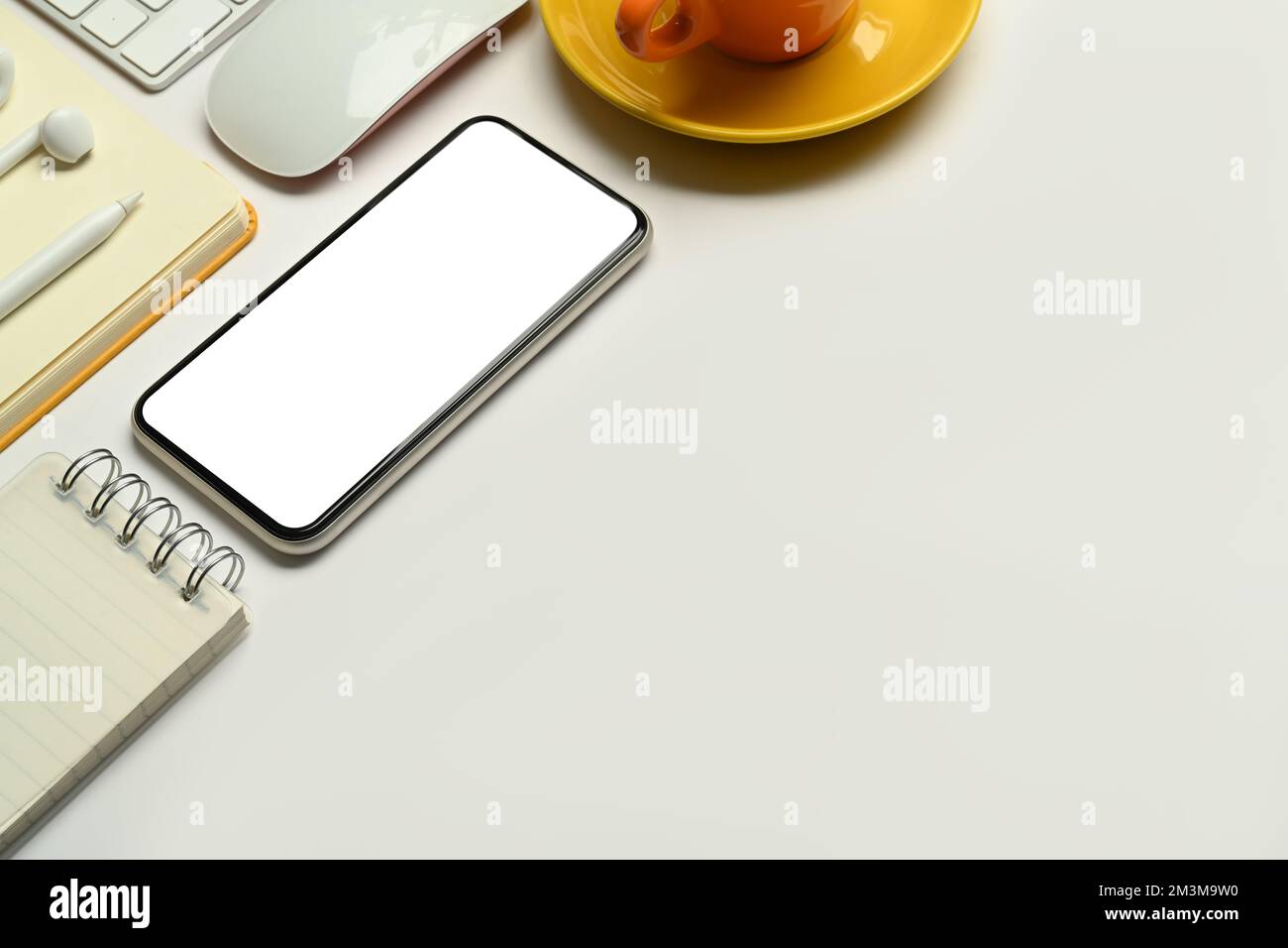 Flat lay mock up smart phone with blank screen, notepad, coffee cup and ...