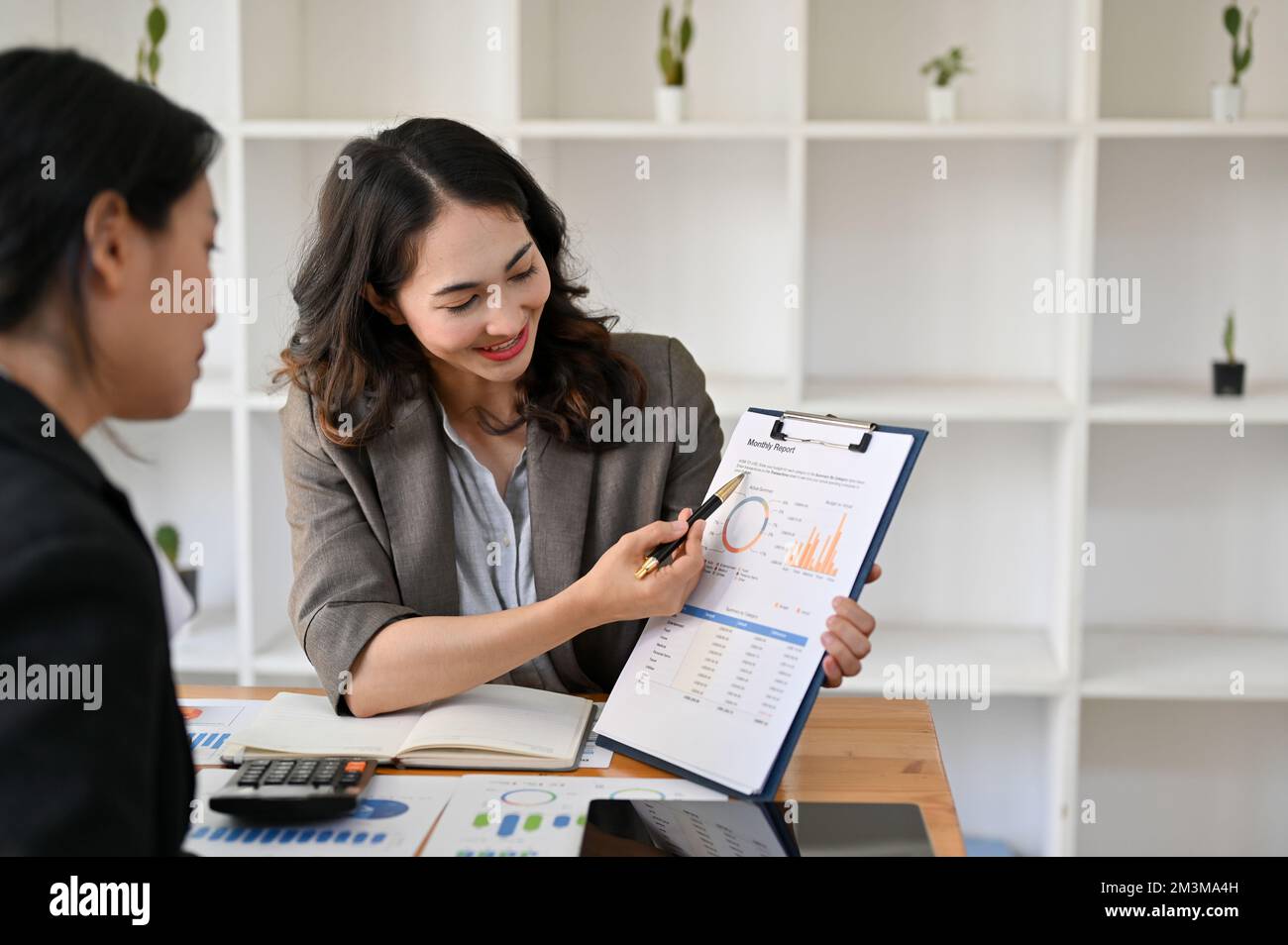 Female secretary explaining boss in hi-res stock photography and images ...