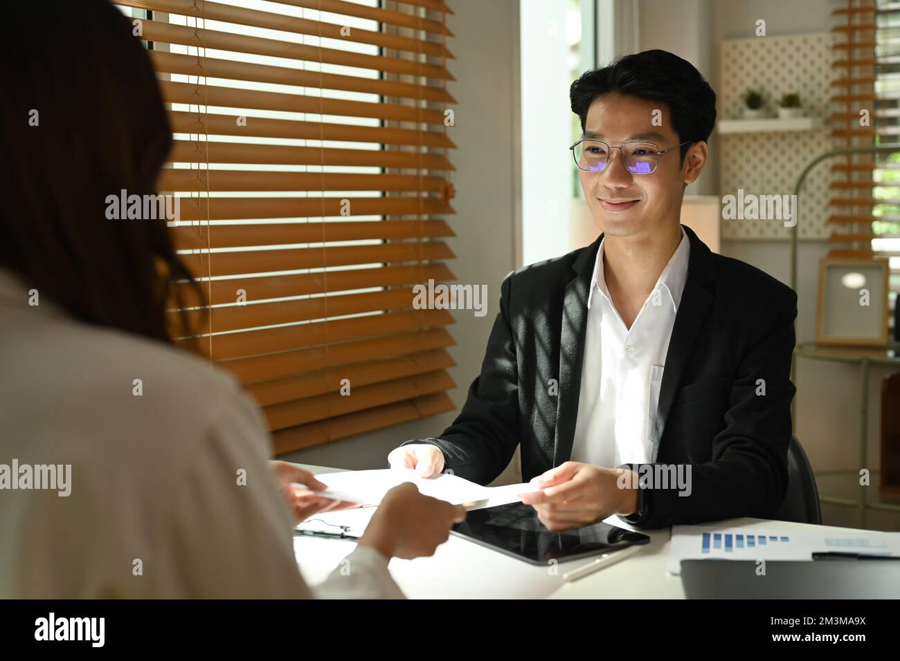 Back view of candidate woman having job interview with recruitment ...
