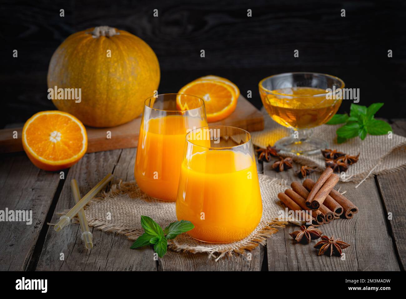 Pumpkin and orange spiced fall cocktail with cinnamon Stock Photo - Alamy