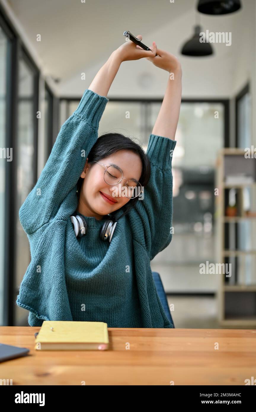 Portrait, Charming and relaxed young Asian female college student ...