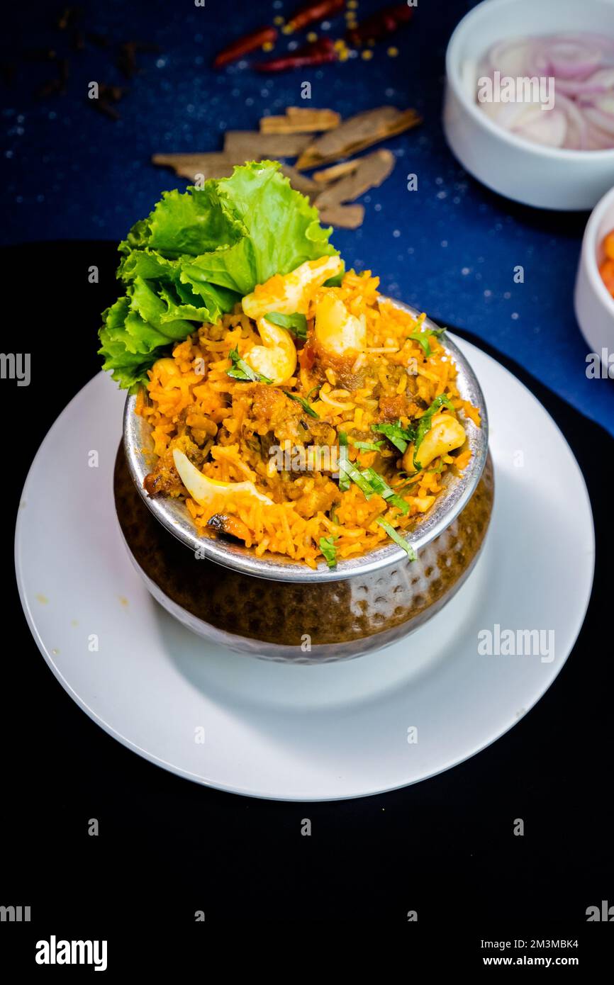 A high-angle shot of a plate full of the Biryani dish with different ...