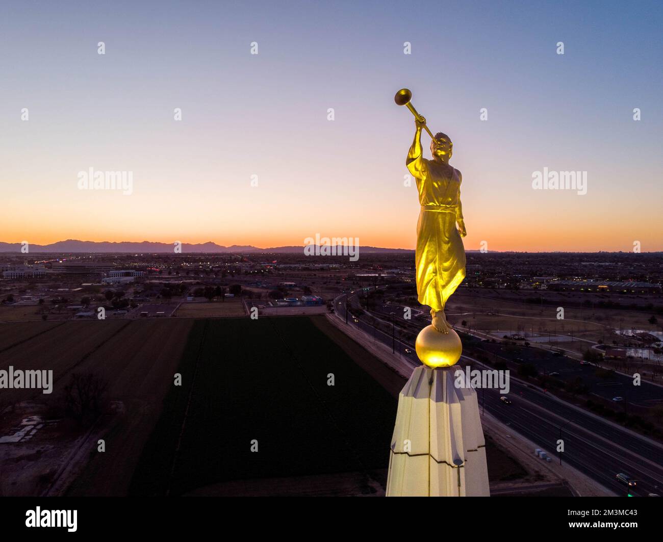 Gilbert LDS temple at sunset Stock Photo - Alamy