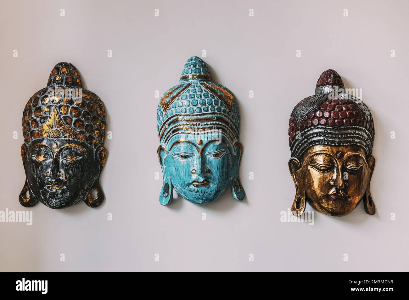 Handmade souvenirs buddha mask on white background. Close up. Isolated ...