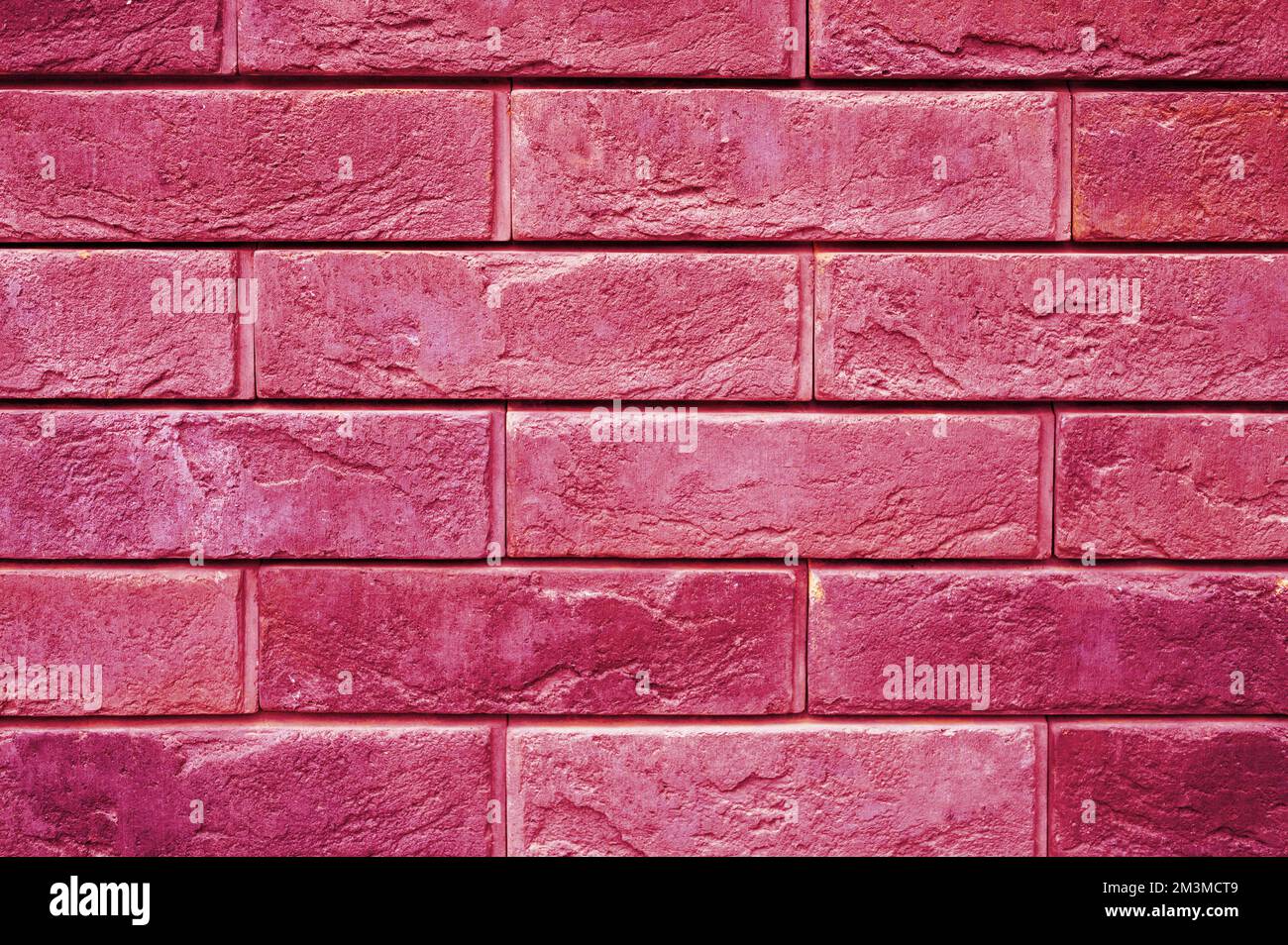 pattern of decorative pink slate stone wall surface as a background ...