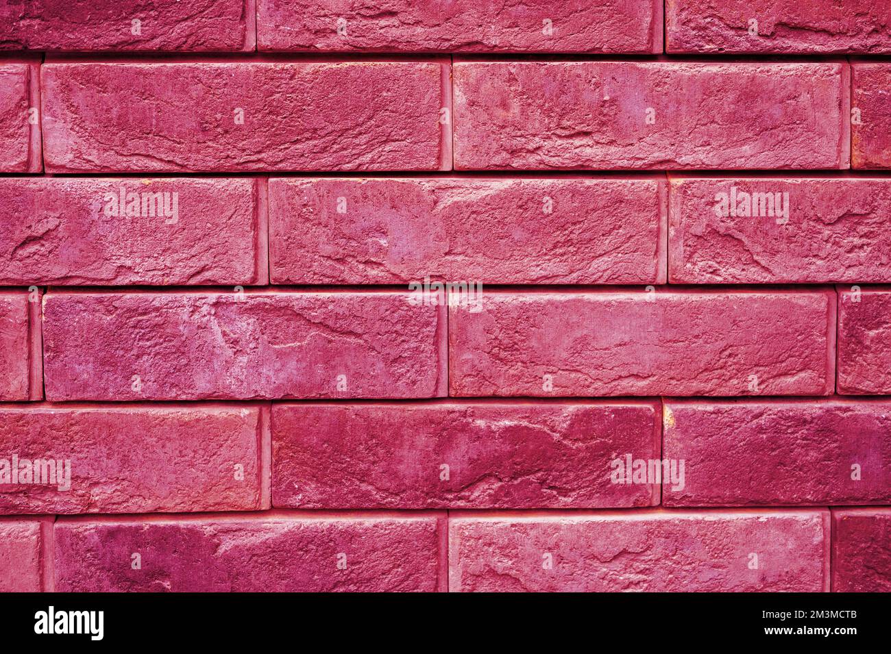 pattern of decorative pink slate stone wall surface as a background ...