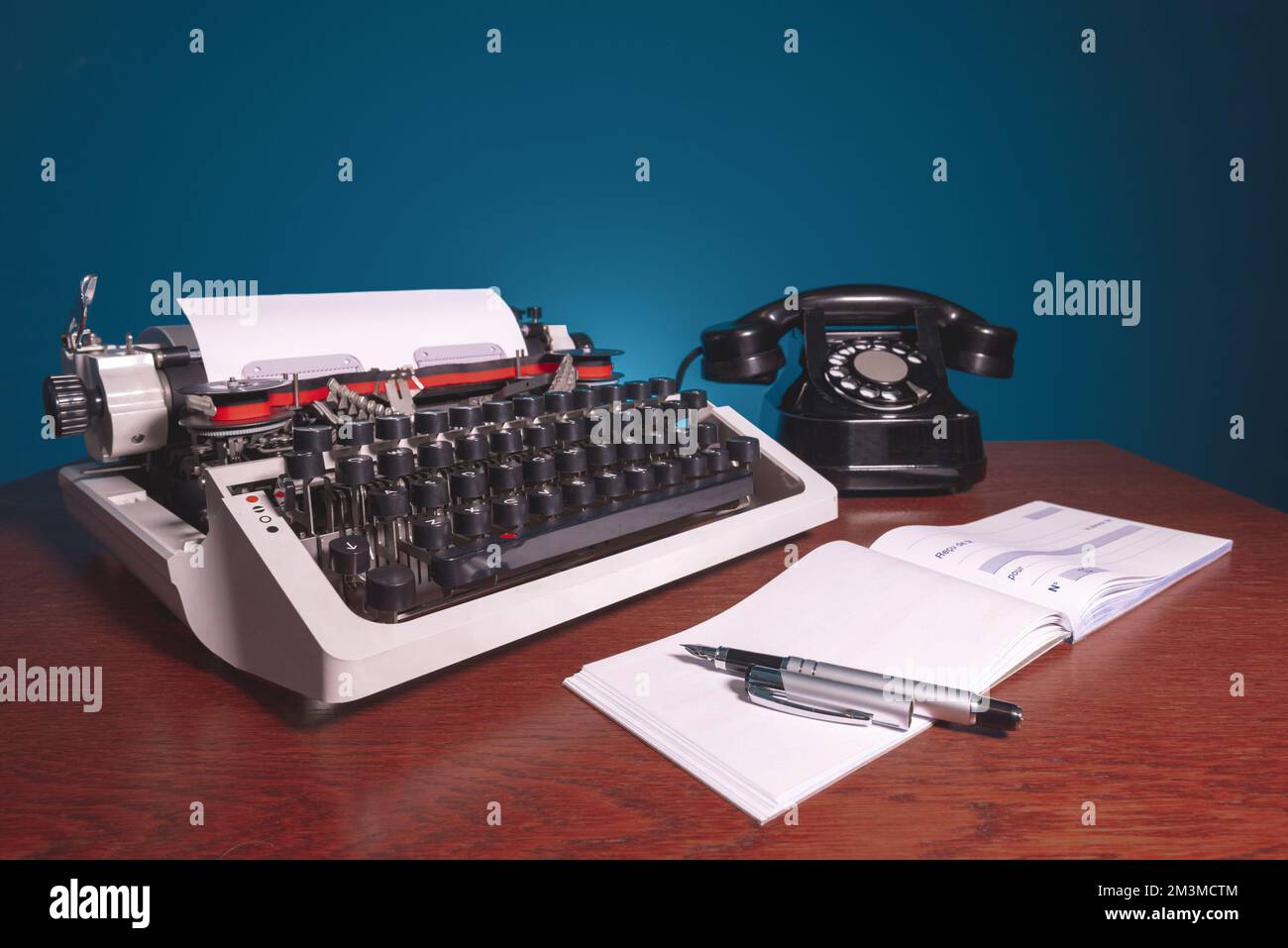 retro typewriter, old telephone, checkbook, ink pen Stock Photo - Alamy