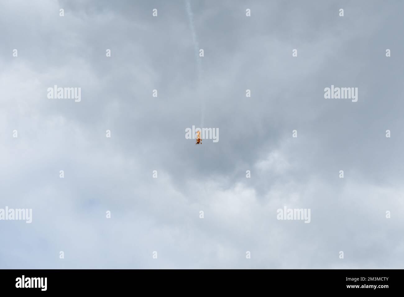 A burning light aircraft falls to the ground. Simulation of a model ...