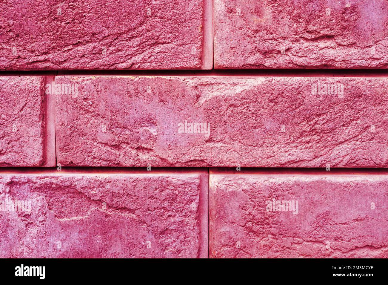 pattern of decorative pink slate stone wall surface as a background ...