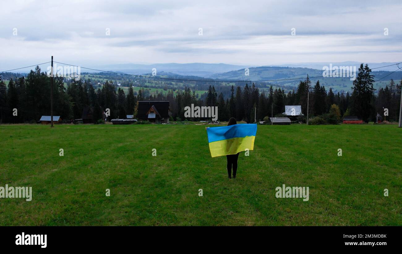 Woman with Ukrainian national flag waving Patriotism Aerial view of ...
