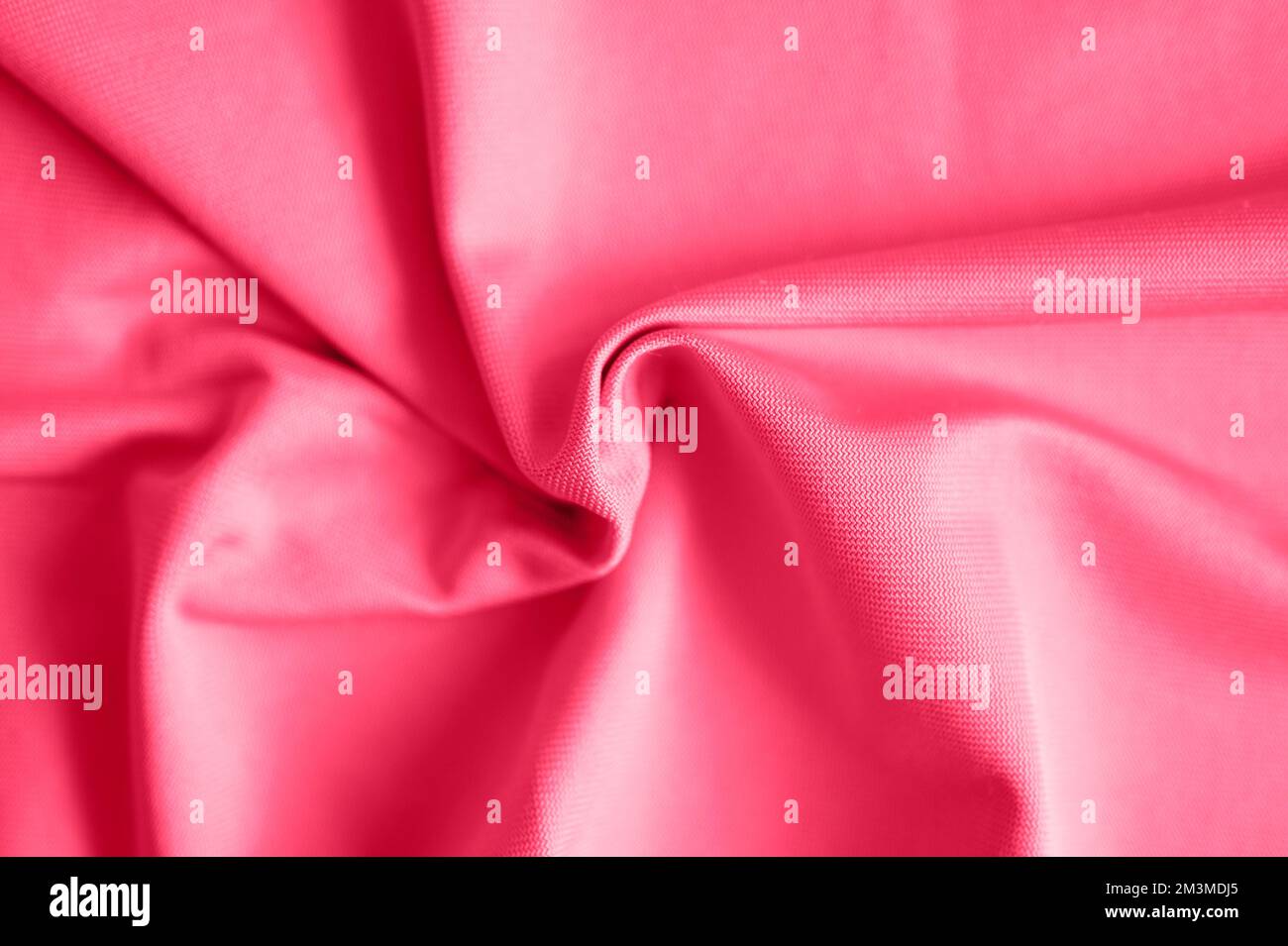microfiber fabric pink color background with pleats, top view. toned in ...