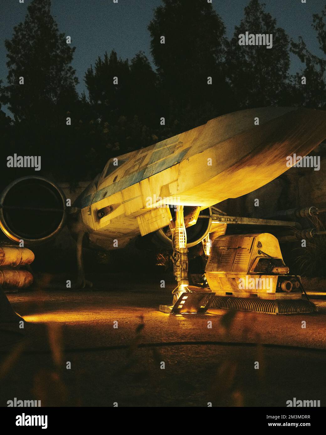 A vertical shot of an old, abandoned starship taken at night in the ...