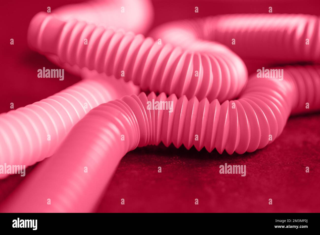 kids anti stress sensory pop tube plastic fidget push toy on a table or ...