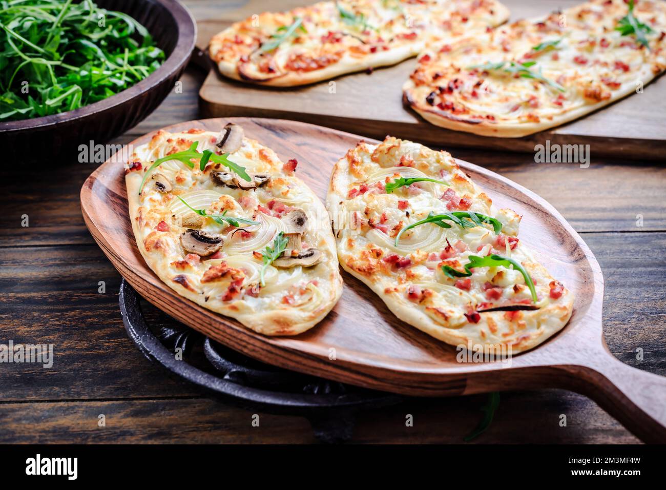 French tarte flambee with cream cheese, bacon and onions. Flammkuchen ...