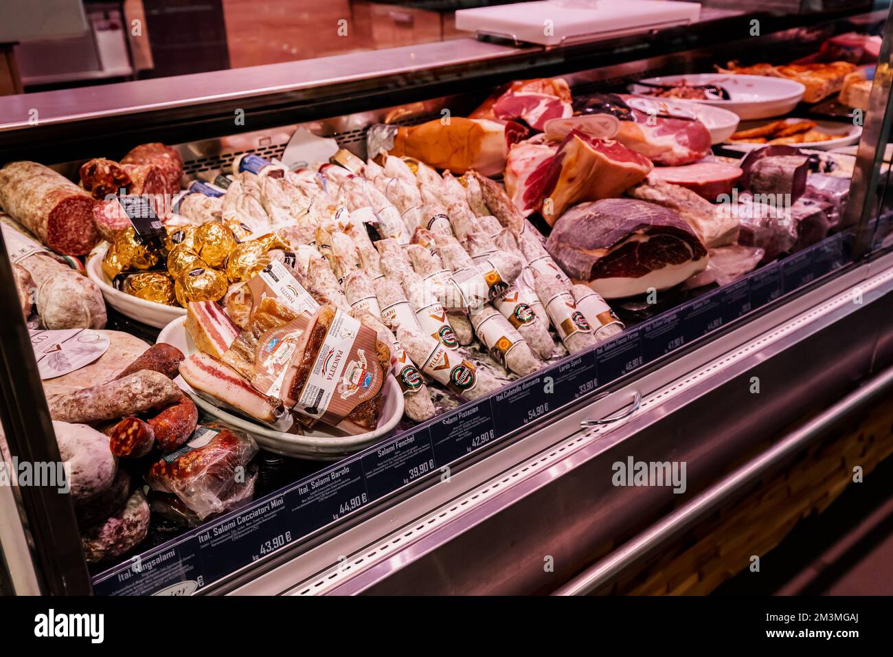 30 July 2022, Cologne, Germany: smoked sorts of sausage and bacon ham ...