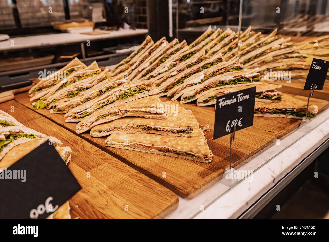 Italian closed focaccia pizza on the counter of the bakery store Stock ...