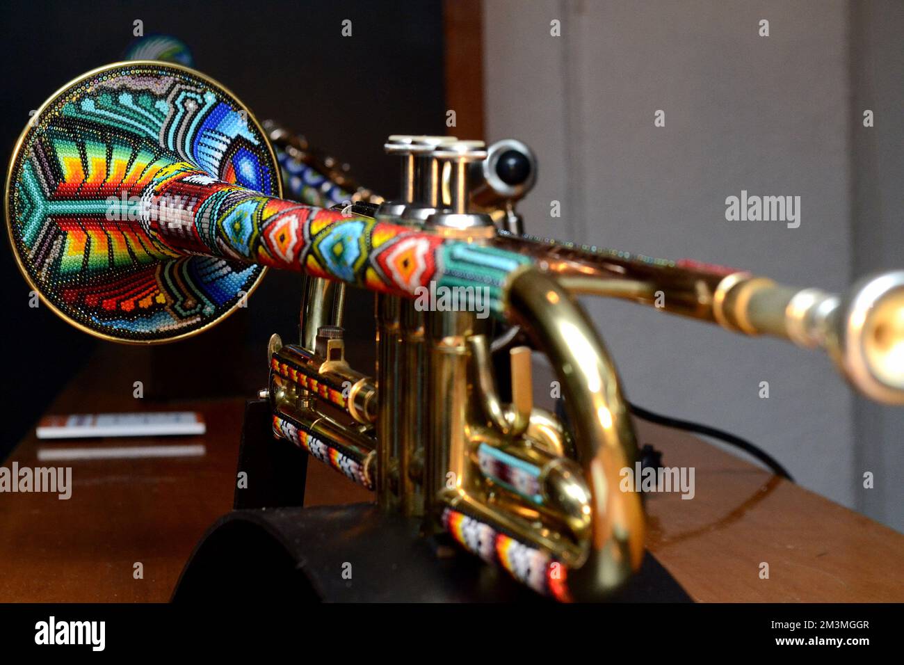 Non Exclusive: a trumpet decorated with designs and ornaments made of ...