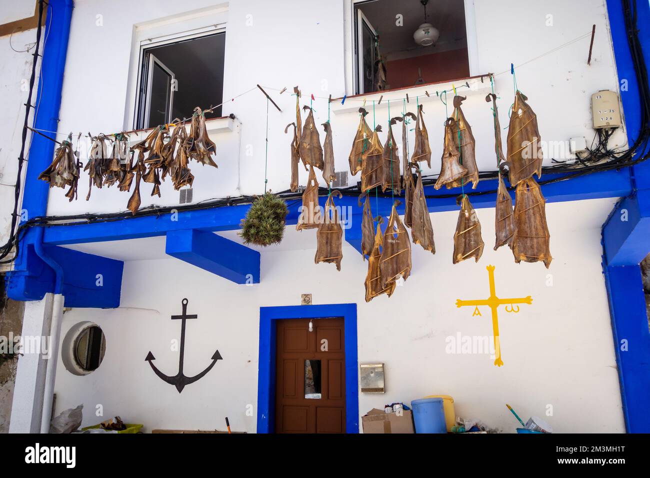 Traditional dried fish in front of a house, Cudillero village, Asturias ...