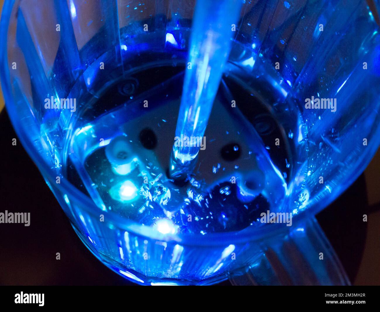 Miniature toy, Fountain with a cup Stock Photo - Alamy