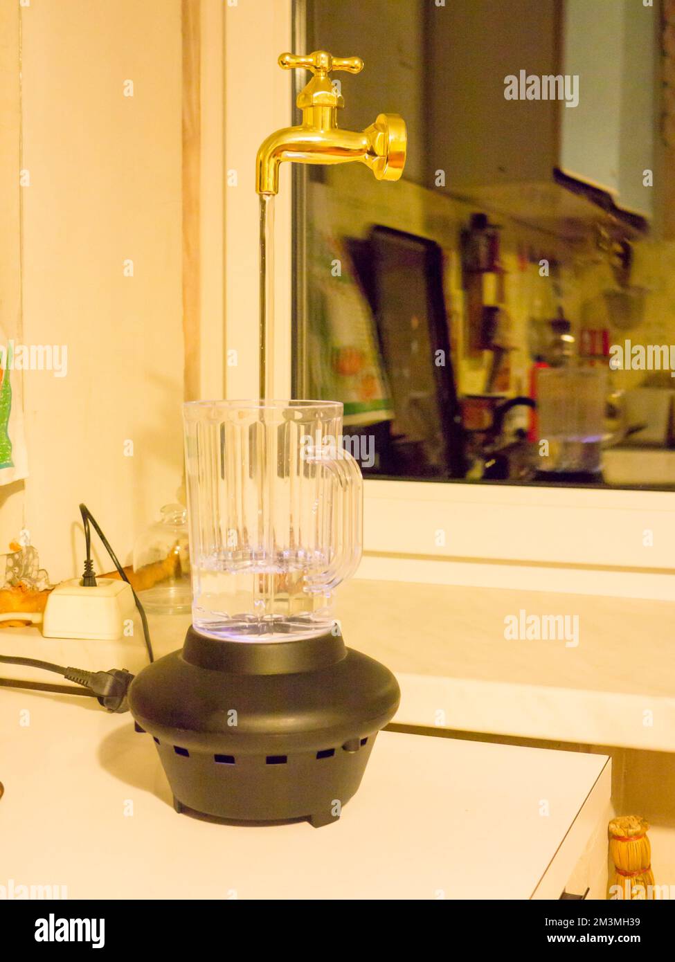 Miniature toy, Fountain with a cup Stock Photo - Alamy