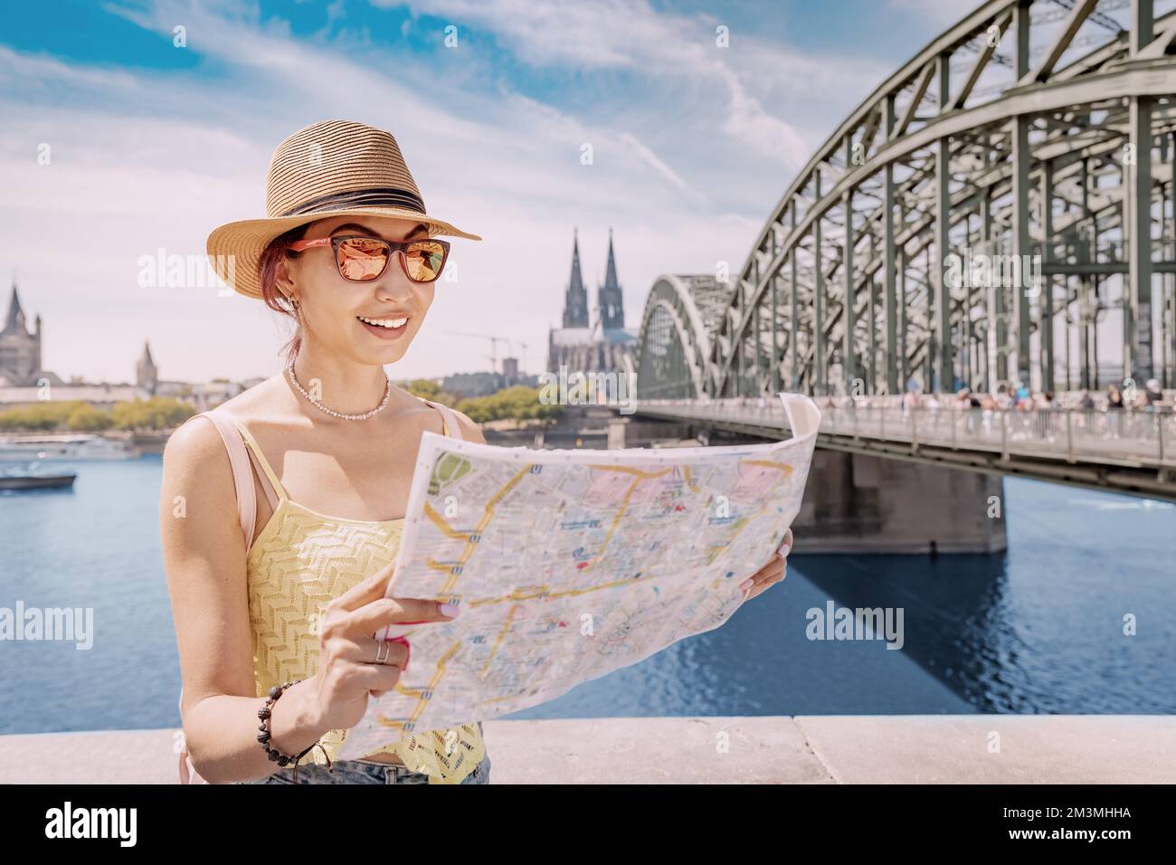 tourist girl with map, searching for landmarks and sights in old ...