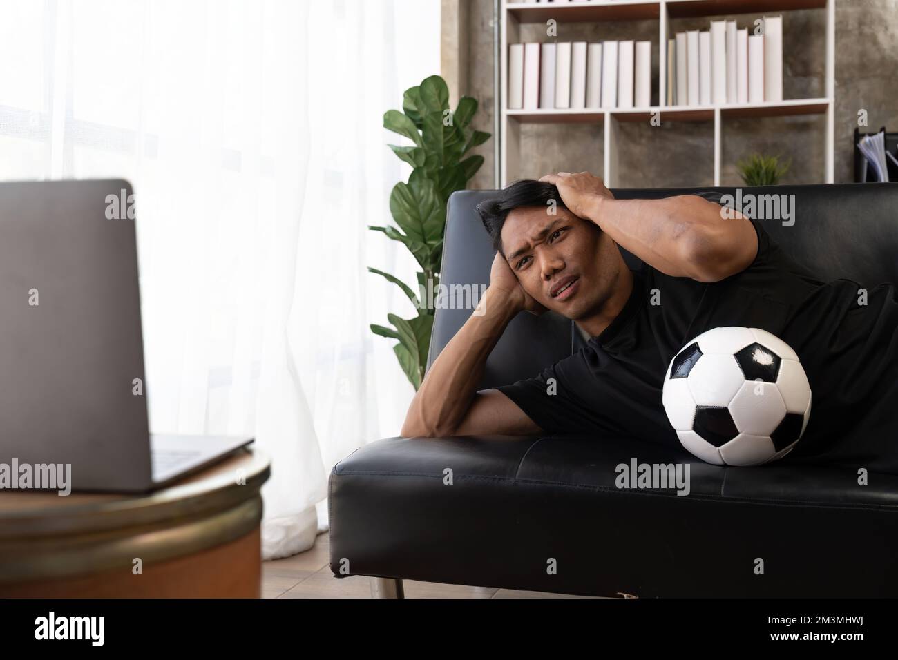 Angry man watching tv on hi-res stock photography and images - Alamy