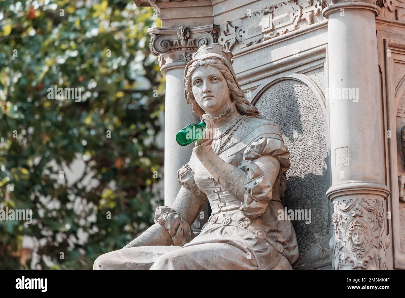 Statue in Cologne old town drinking beer. German Octoberfest and joke ...