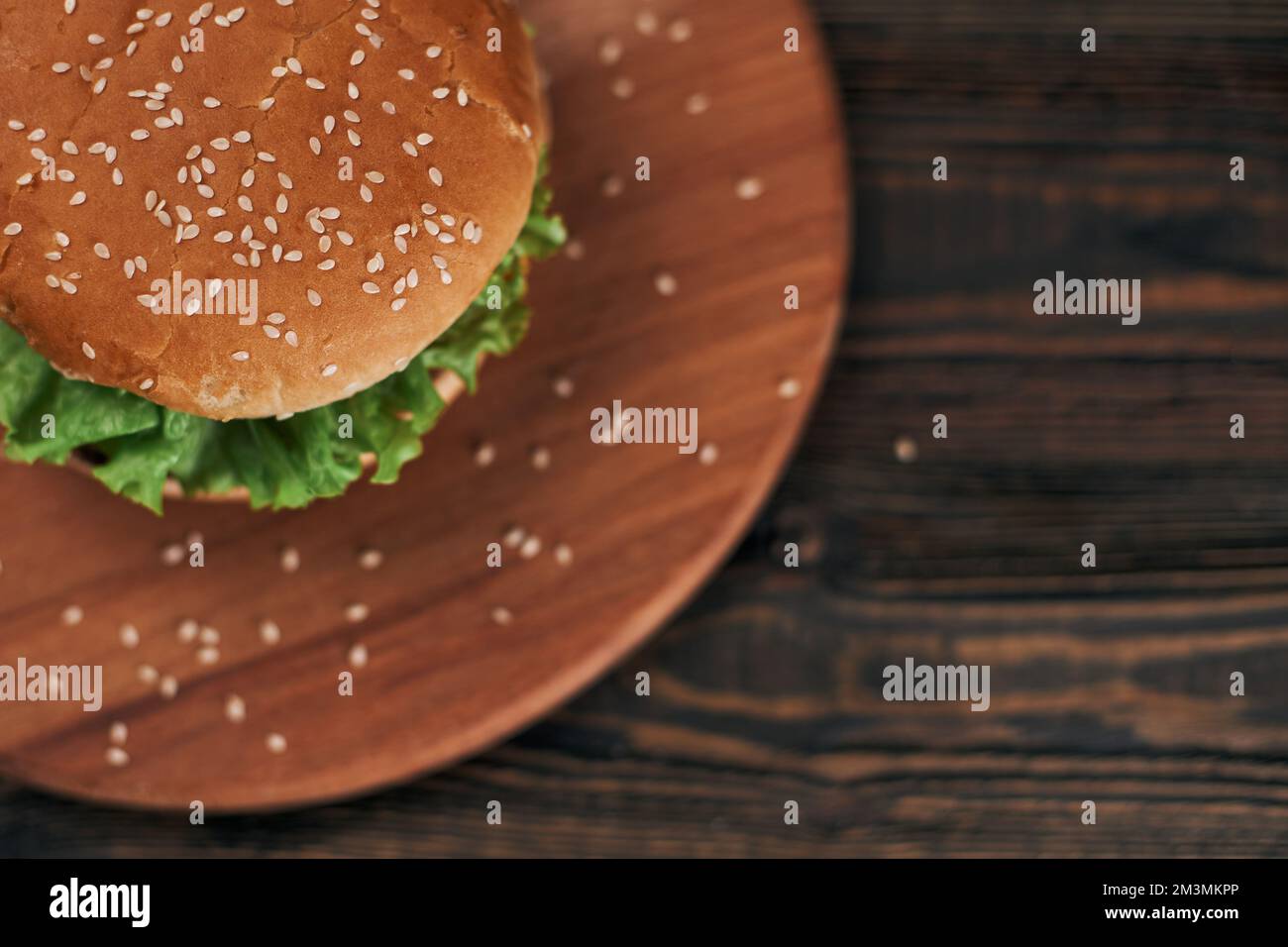 delicious burger on a wooden chopping board Stock Photo - Alamy