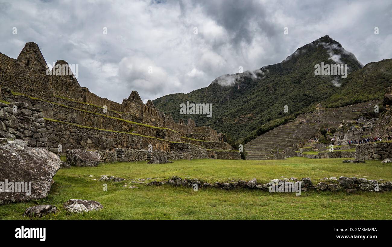 A scenic shot of Machu Picchu in Peru under the cloudy sky, cool for ...