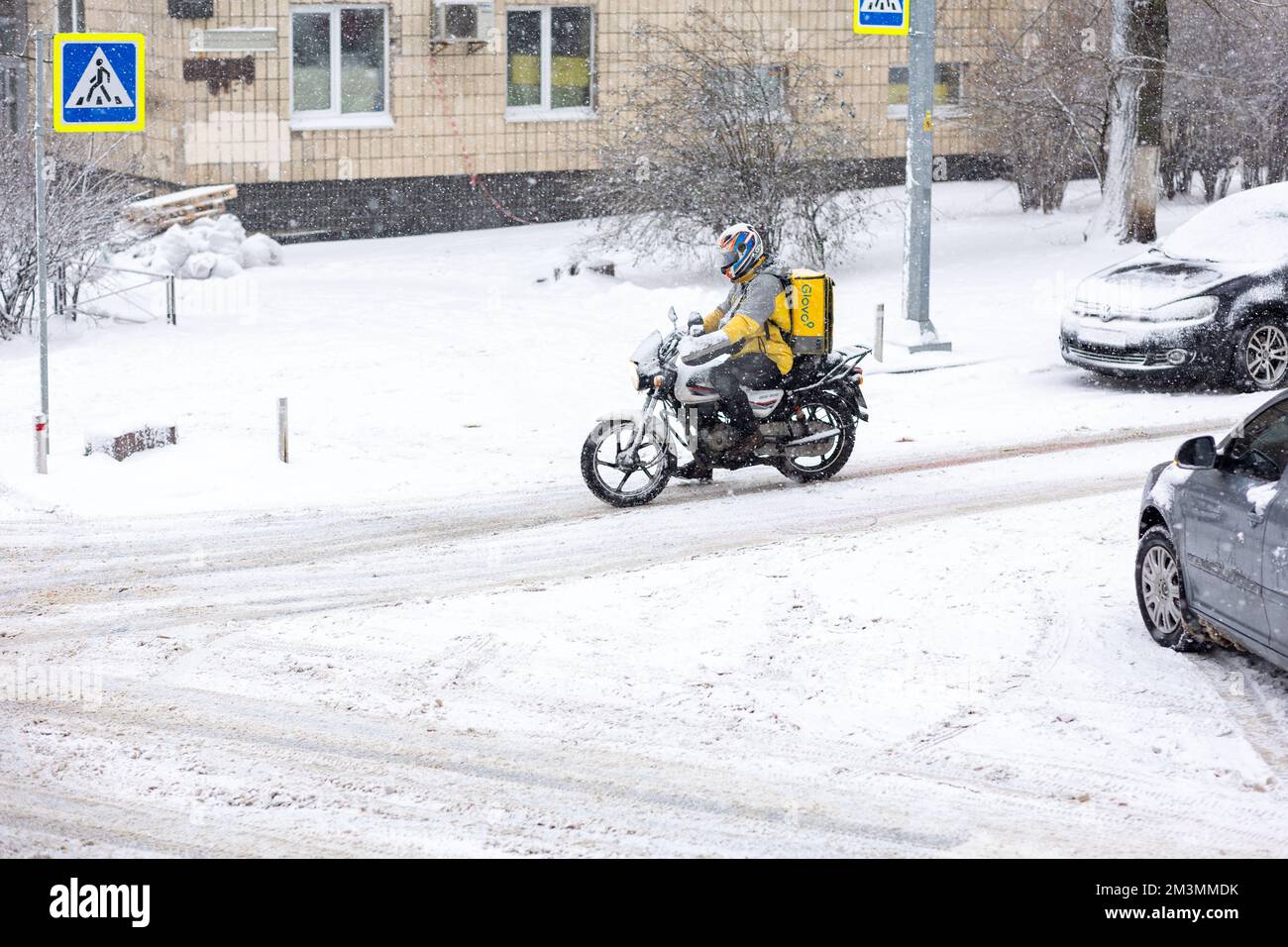 Kiev, Ukraine - December 15, 2023. GLOVO Food delivery courier on a ...